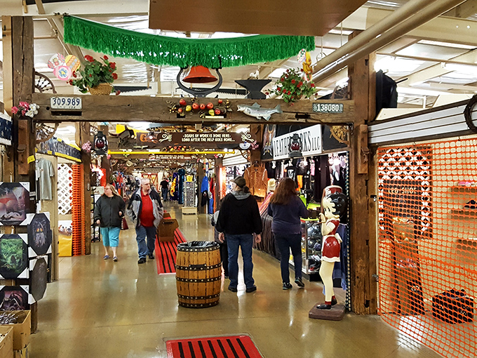 Treasure hunters navigate the endless aisles of Traders World, where wagon wheels overhead watch shoppers hunt for bargains below.