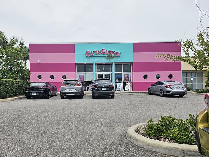 The hot pink facade of Out of the Closet isn't just eye-catching—it's practically screaming "bargains inside!" like a fashionable beacon in St. Petersburg.