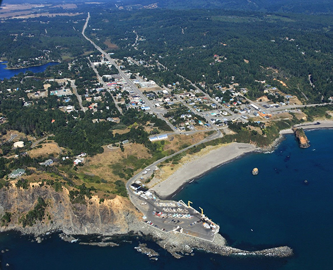 Port Orford from above looks like nature decided to create the perfect postcard—complete with dramatic headlands, a working harbor, and a town that refuses to be ordinary.