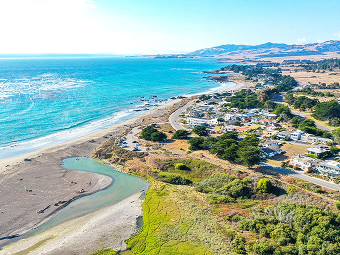 Cambria's coastline looks like Mother Nature showing off her best work—turquoise waters meeting golden shores under California's impossibly blue skies.