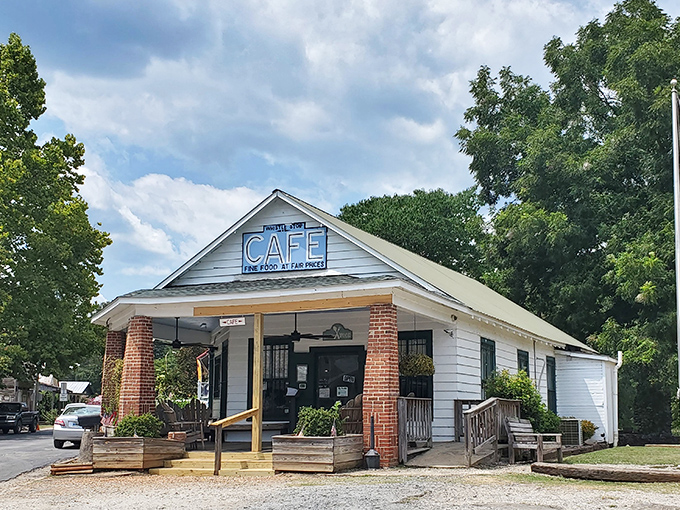 The quintessential Southern porch experience awaits at this charming white clapboard cafe. Those chairs aren't just for show—they're for savoring the anticipation.