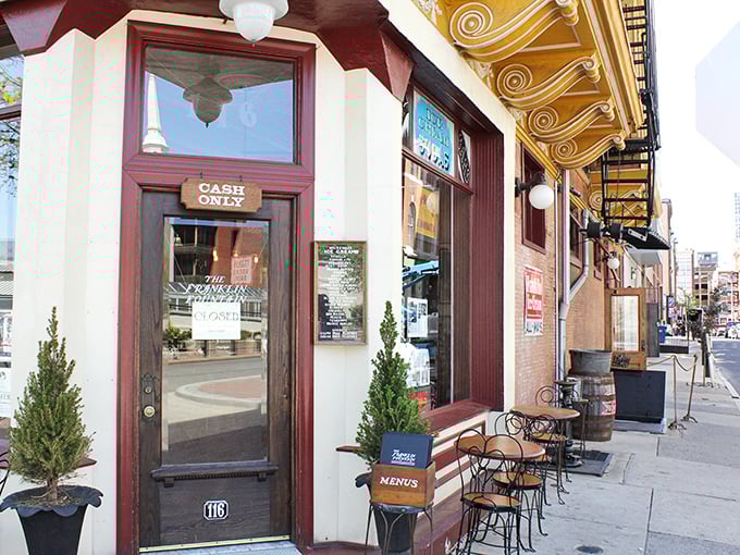 Step through this burgundy-trimmed doorway and prepare to time travel. The "CASH ONLY" sign is your first clue that authenticity trumps convenience here.