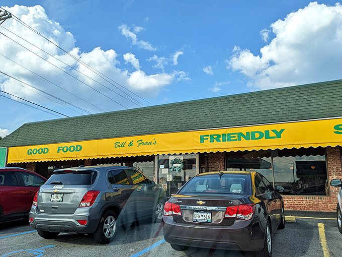 That bright yellow awning isn't just a sign—it's a beacon of breakfast hope promising "Good Food" and "Friendly" service. Truth in advertising at its finest. 