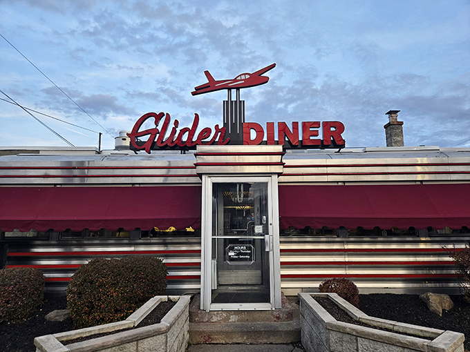 That little red airplane isn't just decoration – it's pointing you toward culinary heaven in classic diner style.