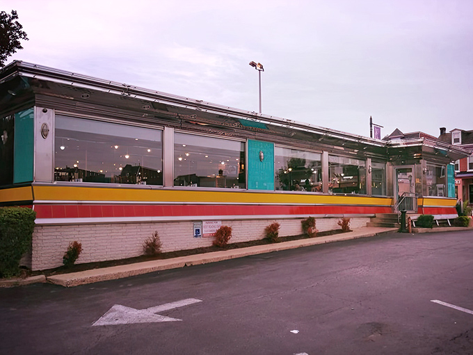 The classic stainless steel exterior with vibrant stripes promises comfort food nirvana before you even step inside.