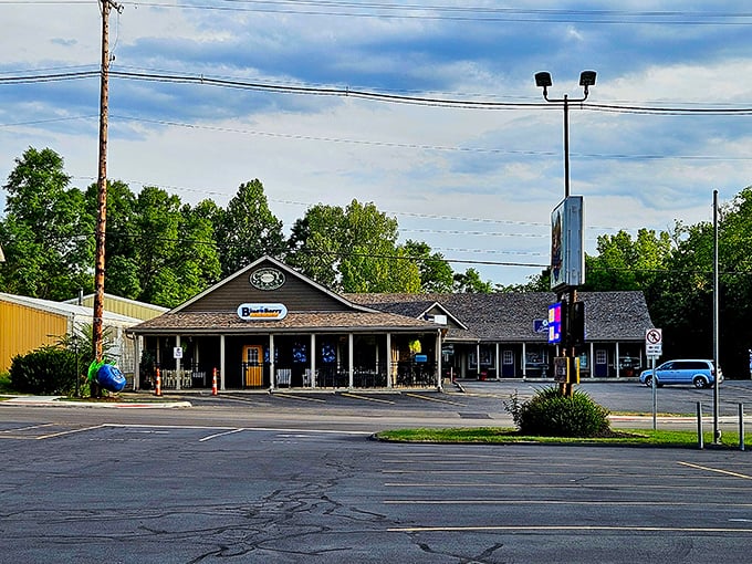 The unassuming exterior of The Blue Berry Café belies the culinary treasures within. Like all great breakfast spots, the packed parking lot tells the real story.