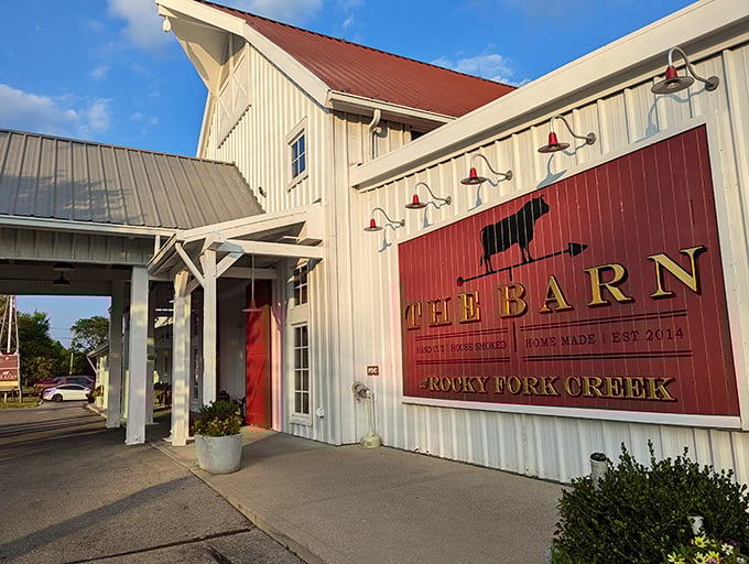 The classic white barn exterior with bold red signage isn't just Instagram-worthy—it's the architectural equivalent of a warm welcome to your taste buds.