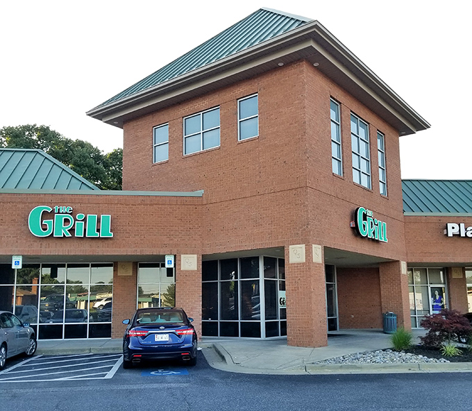 The brick exterior with its bold green sign promises no pretension—just honest food that speaks volumes without needing a fancy facade.