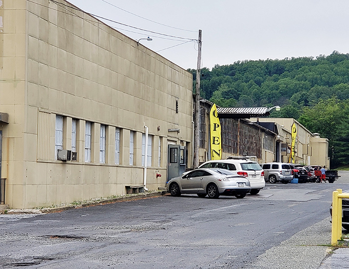 The sunshine-yellow sign beckons like a treasure map X-marks-the-spot. Fensty's doesn't whisper "bargains"—it shouts it from the roadside!