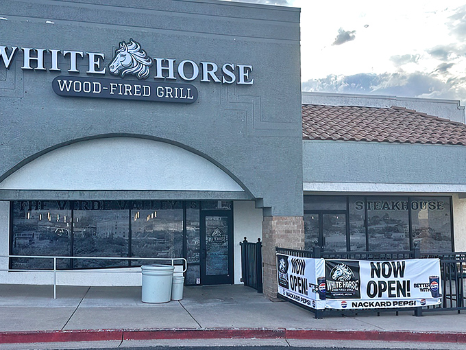 The unassuming exterior of White Horse Wood-Fired Grill might fool you, but trust me—culinary treasures await behind those modest doors.