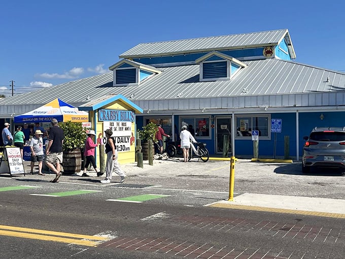 The iconic blue exterior of Crabby Bill's stands like a beacon of seafood salvation on Indian Rocks Beach, promising treasures from the Gulf within.