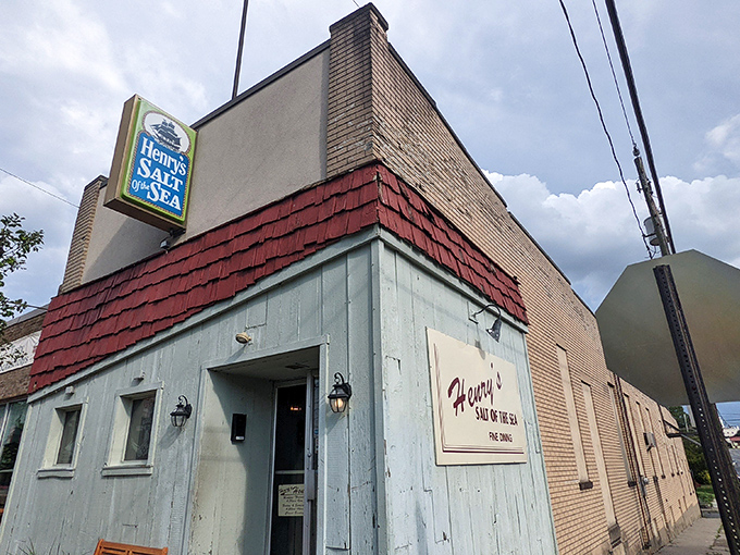 That weathered blue exterior whispers "come in" louder than any neon sign ever could.