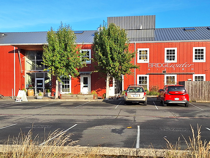 The bright red exterior of Bridgewater Bistro stands out like a cheerful lighthouse, beckoning hungry travelers to dock for dinner in Astoria.