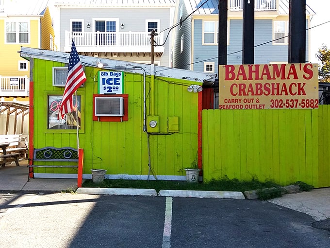 The lime-green beacon of seafood salvation! Bahama's Crabshack stands out like a neon treasure chest on Fenwick Island, promising oceanic delights within.