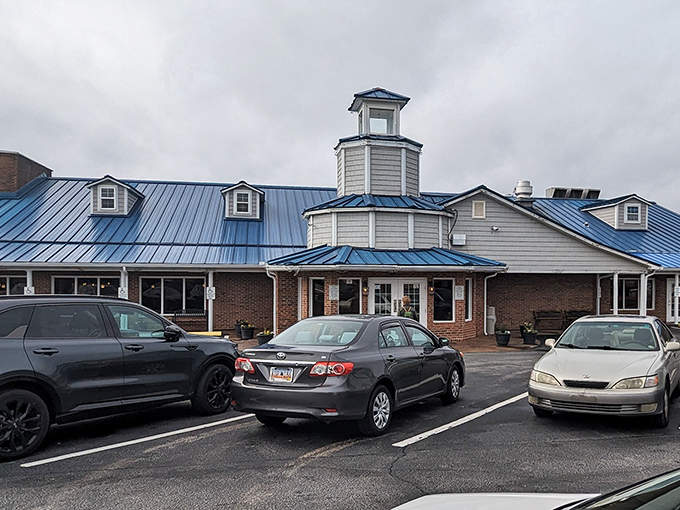 That iconic blue roof beckons like a lighthouse for hungry seafood lovers, promising maritime delights in landlocked Clinton.