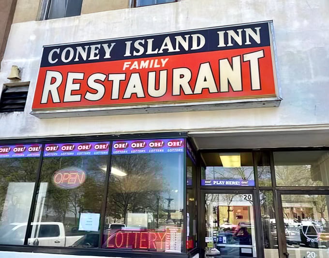 The classic red and blue sign beckons like a lighthouse for hungry travelers. Coney Island Inn has been a Mansfield landmark where comfort food dreams come true.