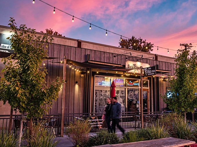 The perfect California-meets-New York moment: Uncle Vito's outdoor seating area, where Sacramento sunshine meets East Coast pizza tradition under those inviting red awnings.