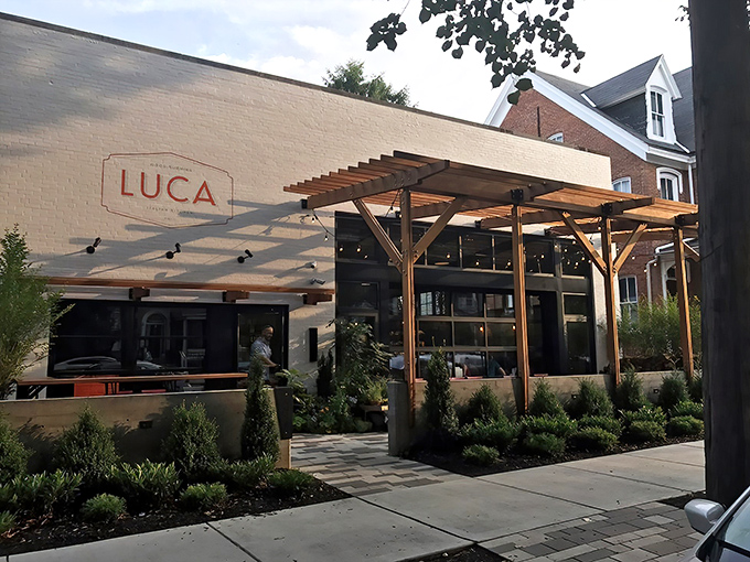 LUCA's exterior blends rustic charm with modern elegance, that wooden pergola practically whispering "come inside, the pasta's waiting" to passersby on James Street.