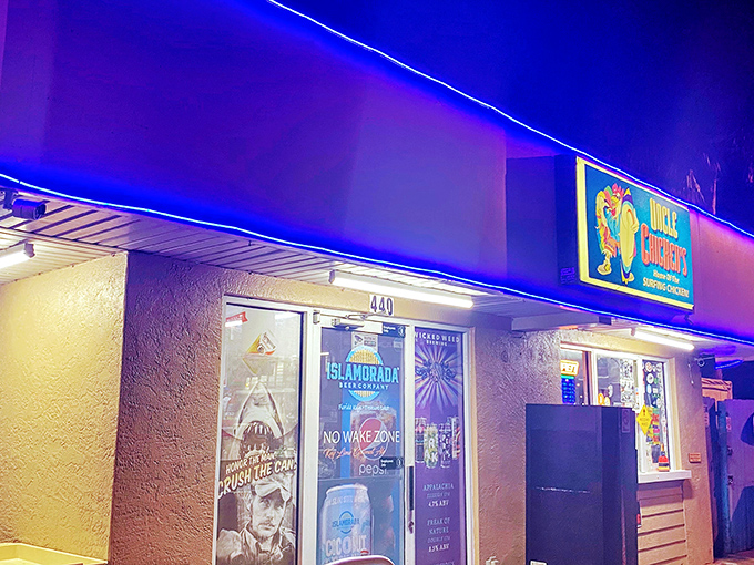 The neon blue glow of Uncle Chicken's at night isn't just a beacon for hungry travelers—it's practically a lighthouse for flavor-seeking souls.