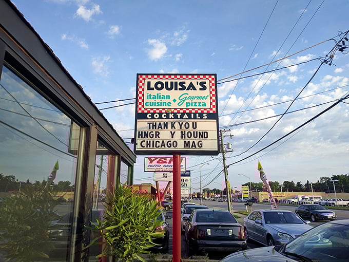 The iconic red-and-white checkered sign beckons pizza pilgrims like a lighthouse guiding hungry sailors home. Simplicity on the outside, magic within.