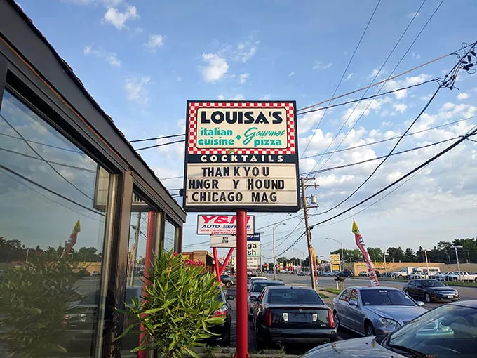 The iconic red-and-white checkered sign beckons pizza pilgrims like a lighthouse guiding hungry sailors home. Simplicity on the outside, magic within.