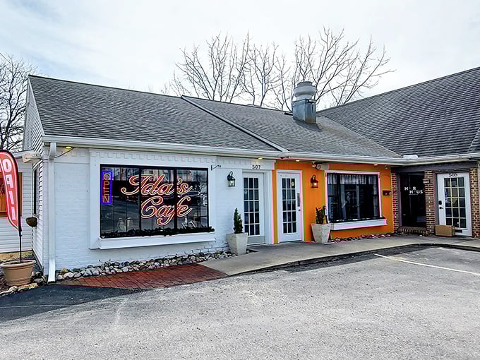 The bright orange accent on Ida's Café exterior isn't just eye-catching—it's like a beacon calling all hungry travelers home to Lancaster.