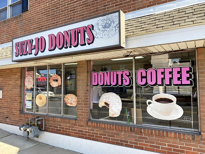 The pink signage of Suzy-Jo Donuts beckons like a sugary lighthouse on Bridgeport's main drag, promising sweet salvation to the donut-deprived.