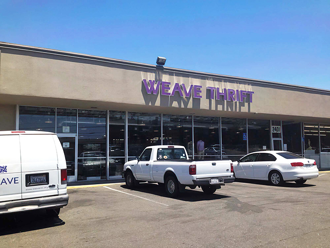 The purple-signed promise of WEAVE Thrift stands proudly against the Sacramento sky, beckoning bargain hunters and treasure seekers alike.