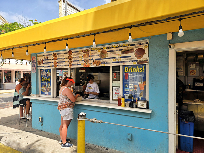 That turquoise paint job isn't just a color choice – it's a beacon calling hungry souls to seafood salvation.