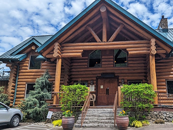 A woodland retreat that doesn't whisper "rustic charm" – it shouts it with those magnificent logs and that striking teal roof. Pacific Northwest architecture at its finest!