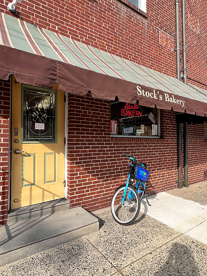 The unassuming brick exterior of Stock's Bakery hides Philadelphia's greatest pound cake secret behind that yellow door and vintage striped awning.