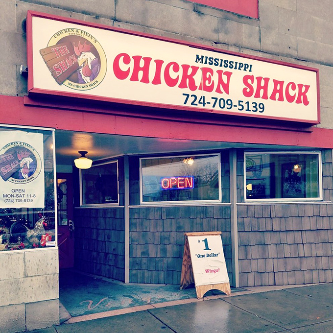 The unassuming storefront of Mississippi Chicken Shack beckons with its bold red sign and humble "$1 Wings!" sidewalk board—culinary treasures often hide in plain sight.