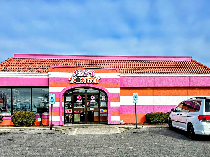 Those pink and orange stripes aren't just eye-catching – they're a beacon calling all donut lovers home.