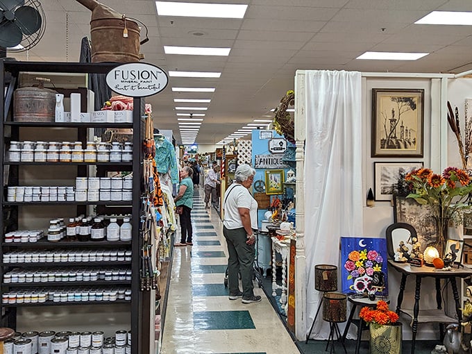 The stately facade of Antique Trove beckons with its elegant columns and distinctive green awning—architectural foreplay for the treasure hunt that awaits inside.