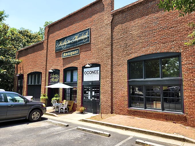 The historic brick façade of Madison Markets welcomes treasure hunters with elegant gold lettering and the promise of discoveries waiting inside.