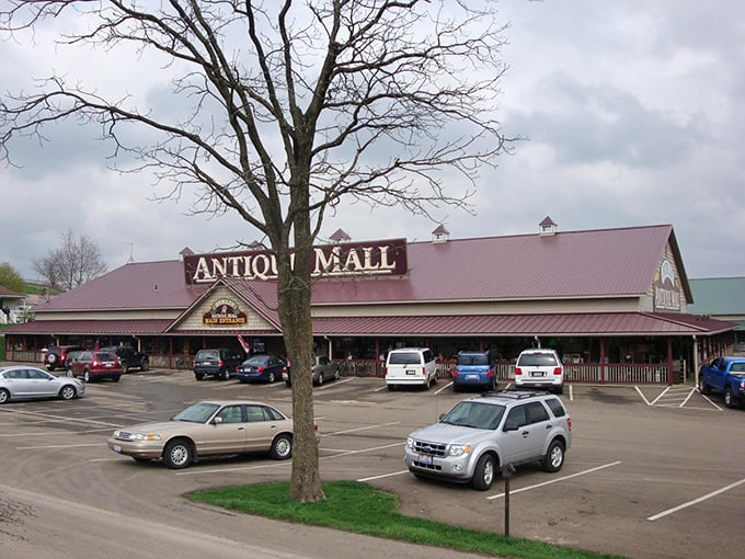 The rustic wooden facade of Berlin Village Antique Mall promises treasures inside like a book cover hints at adventures within.