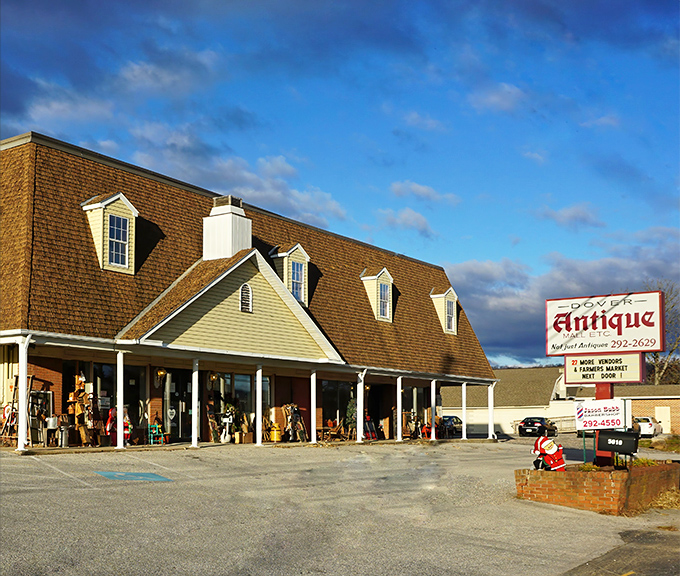The colonial-style exterior of Dover Antique Mall beckons treasure hunters with its dormer windows and welcoming porch—architectural foreplay for the vintage delights within.