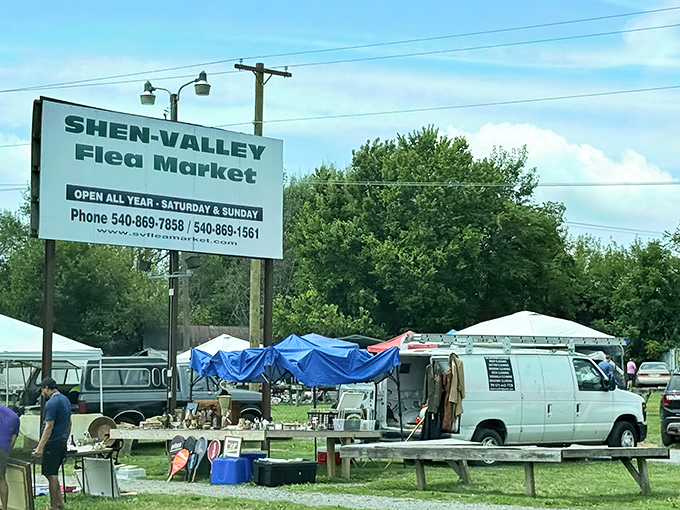 The unassuming entrance to treasure-hunting paradise. Blue tarps and white tents beckon with promises of undiscovered gems and wallet-friendly finds.