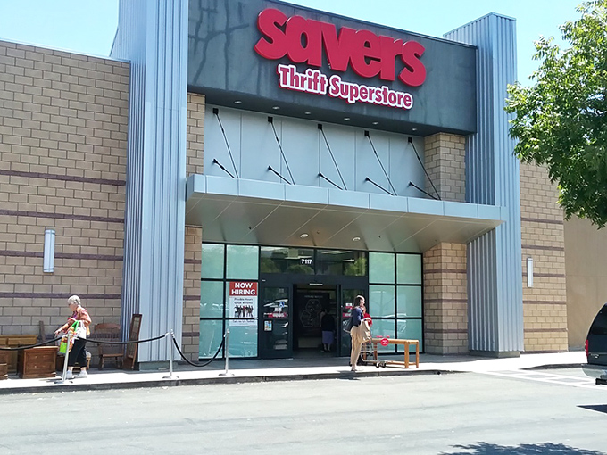 The red "Savers Thrift Superstore" sign beckons like a beacon for bargain hunters seeking retail redemption.