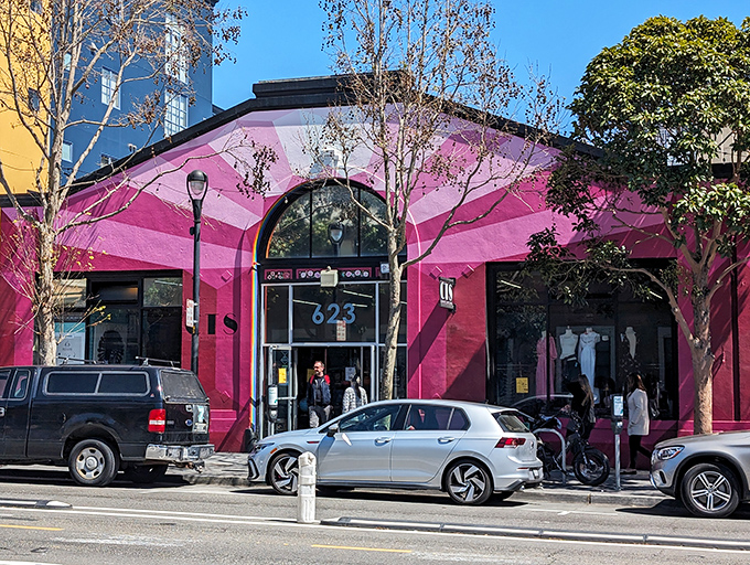 The hot pink exterior of Community Thrift Store isn't just eye-catching—it's a beacon of bargain-hunting hope in San Francisco's Mission District.