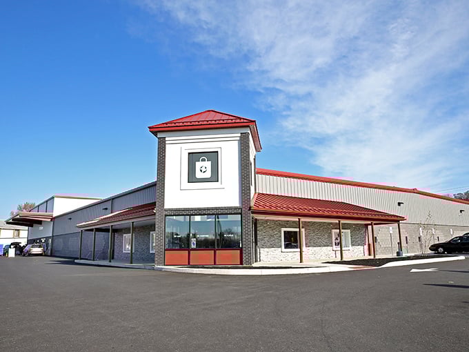 The distinctive red-roofed building stands like a beacon for bargain hunters, promising treasures within its modern exterior.