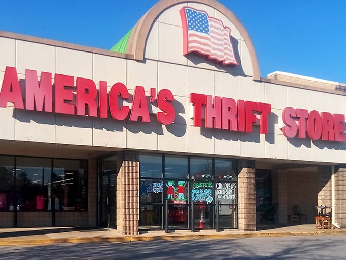 The iconic red signage of America's Thrift Store beckons bargain hunters like a retail lighthouse guiding ships to treasure-filled shores.