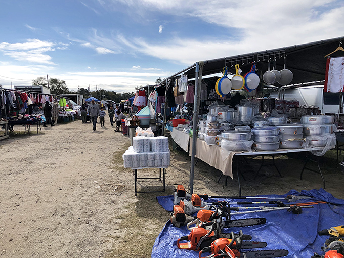 Where treasure hunting meets Florida sunshine – rows of vendors offering everything from kitchenware to chainsaws under brilliant blue skies.