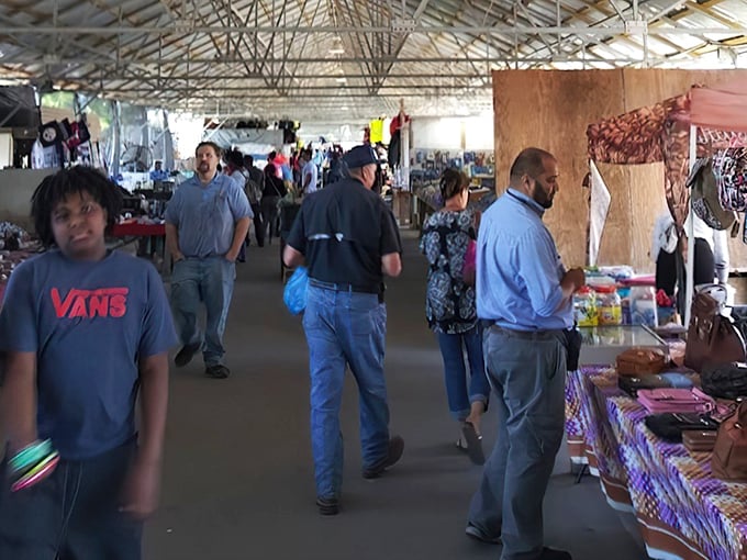 Treasure hunters navigate the covered walkways of Coastal Carolina Flea Market, where every aisle promises unexpected discoveries and memorable encounters.