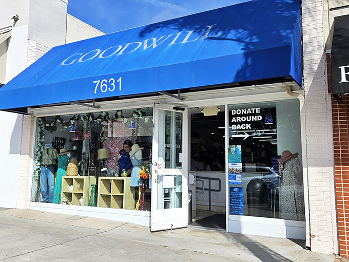 The iconic blue awning of La Jolla's Goodwill beckons like a secret club for bargain hunters who know where the real treasures hide.