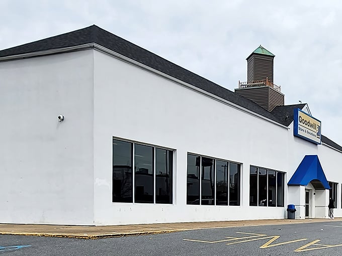 The distinctive white building with blue trim and cupola stands like a beacon for bargain hunters across Delaware, promising adventures in affordability.