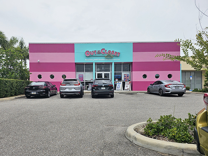 The hot pink facade of Out of the Closet isn't just eye-catching—it's practically screaming "bargains inside!" like a fashionable beacon in St. Petersburg.