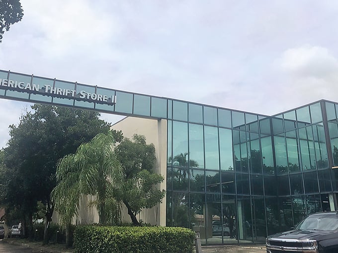 The sleek glass facade of American Thrift Store in Lauderhill stands out like a designer handbag at a yard sale—unexpectedly upscale.