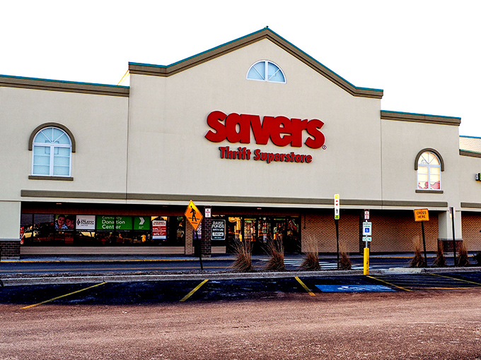 The iconic red Savers sign beckons like a lighthouse for bargain hunters. This unassuming exterior houses a universe of possibilities.