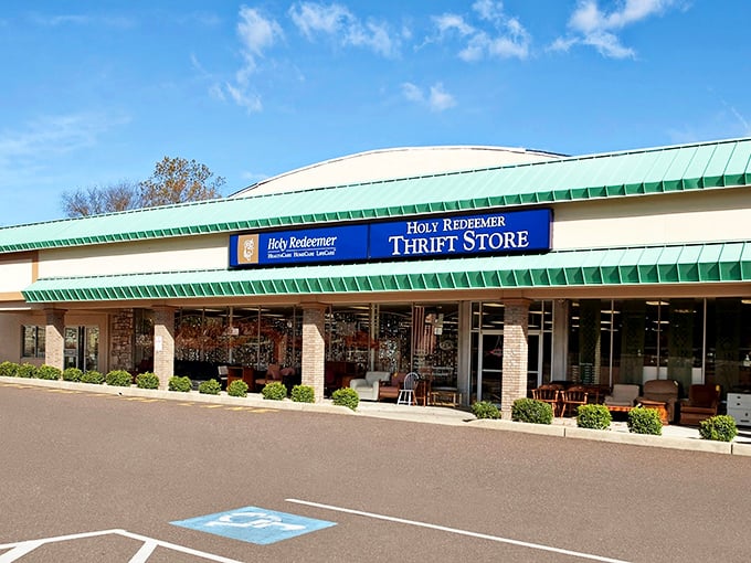 The unassuming exterior of Holy Redeemer Thrift Shop—where bargain hunters' dreams and Marie Kondo's nightmares collide in glorious retail harmony.